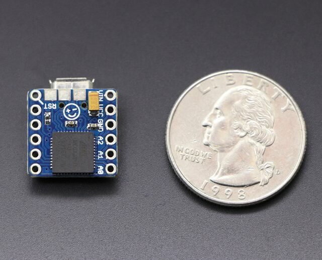 The PICO alongside a coin - Electronics-Lab.com